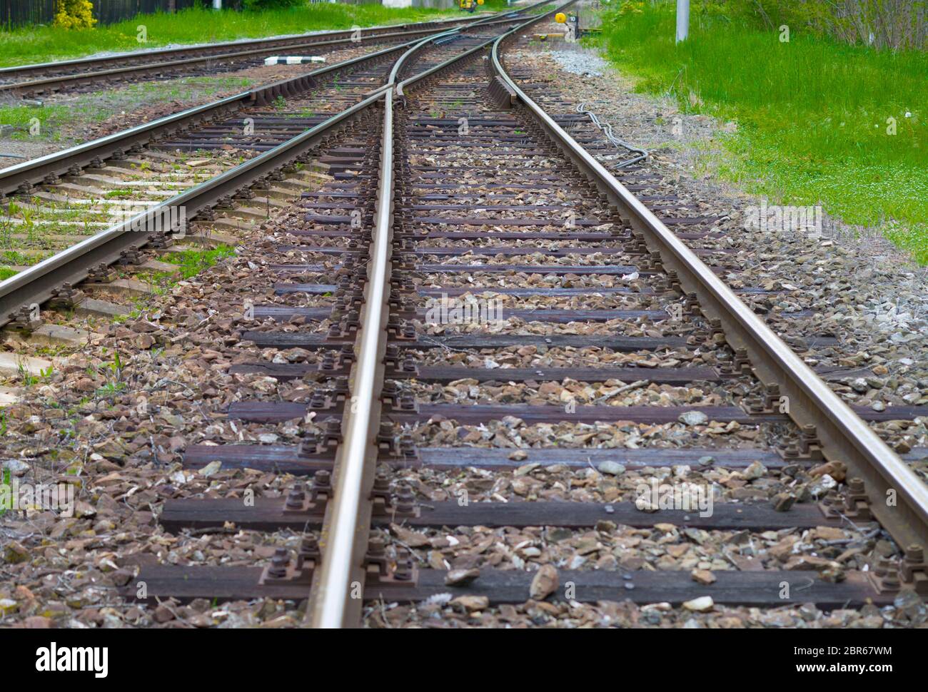 Railroad tracks split several tracks into one Stock Photo - Alamy
