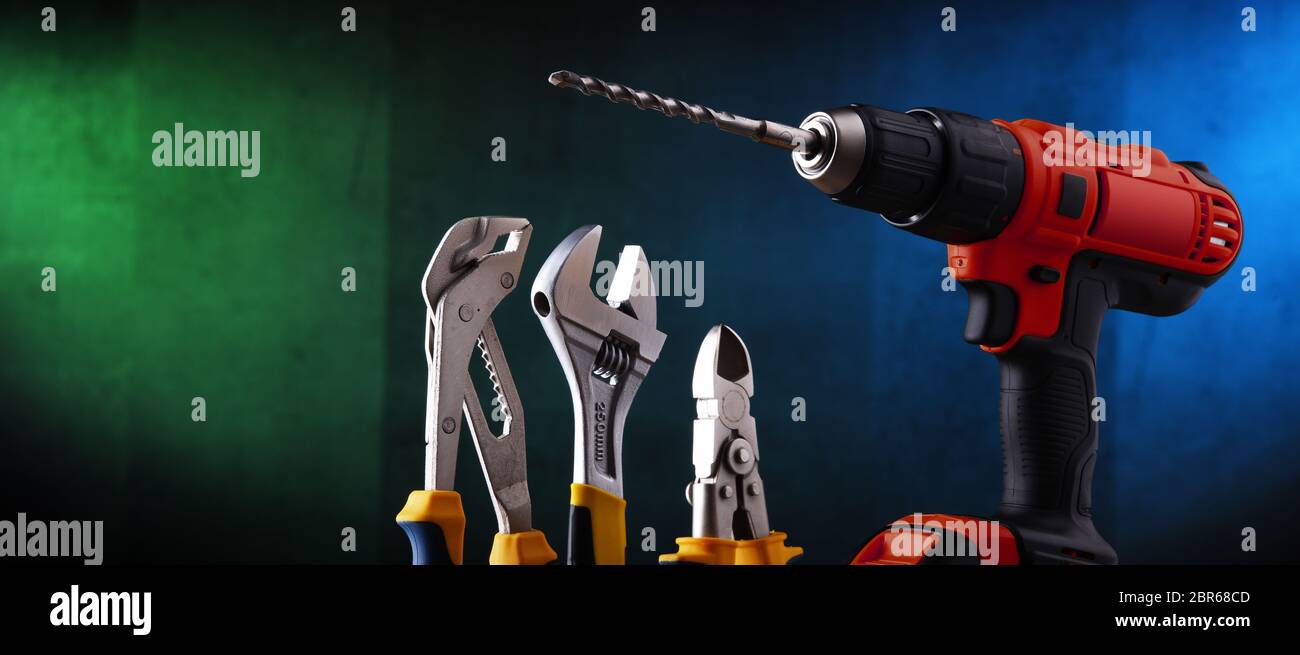 Composition with hardware tools including cordless drill and monkey ...