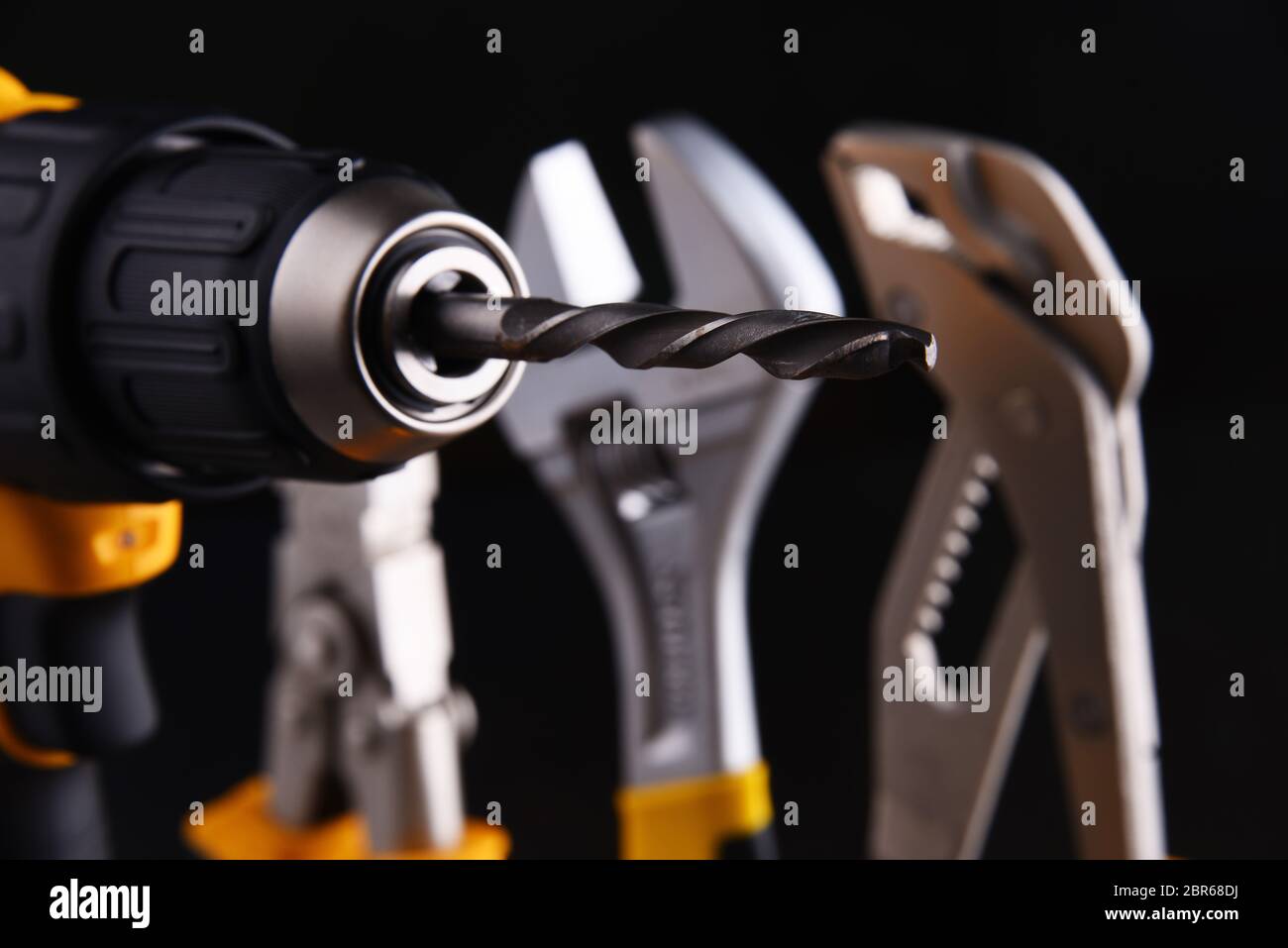 Composition with hardware tools including cordless drill and monkey ...