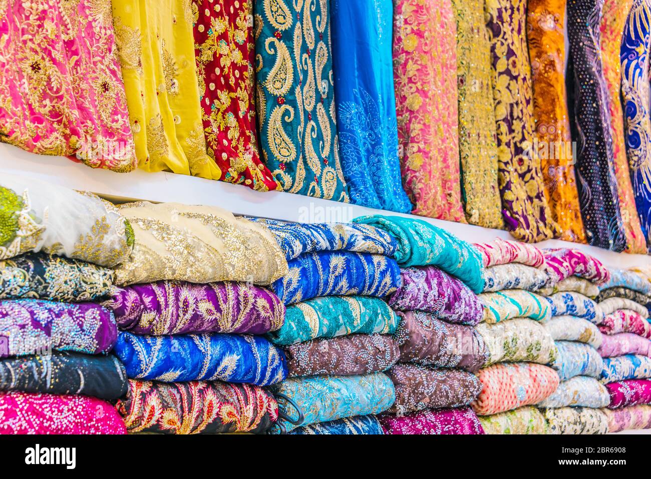 Traditional oriental cloth sold in a store in old town Dubai, United ...