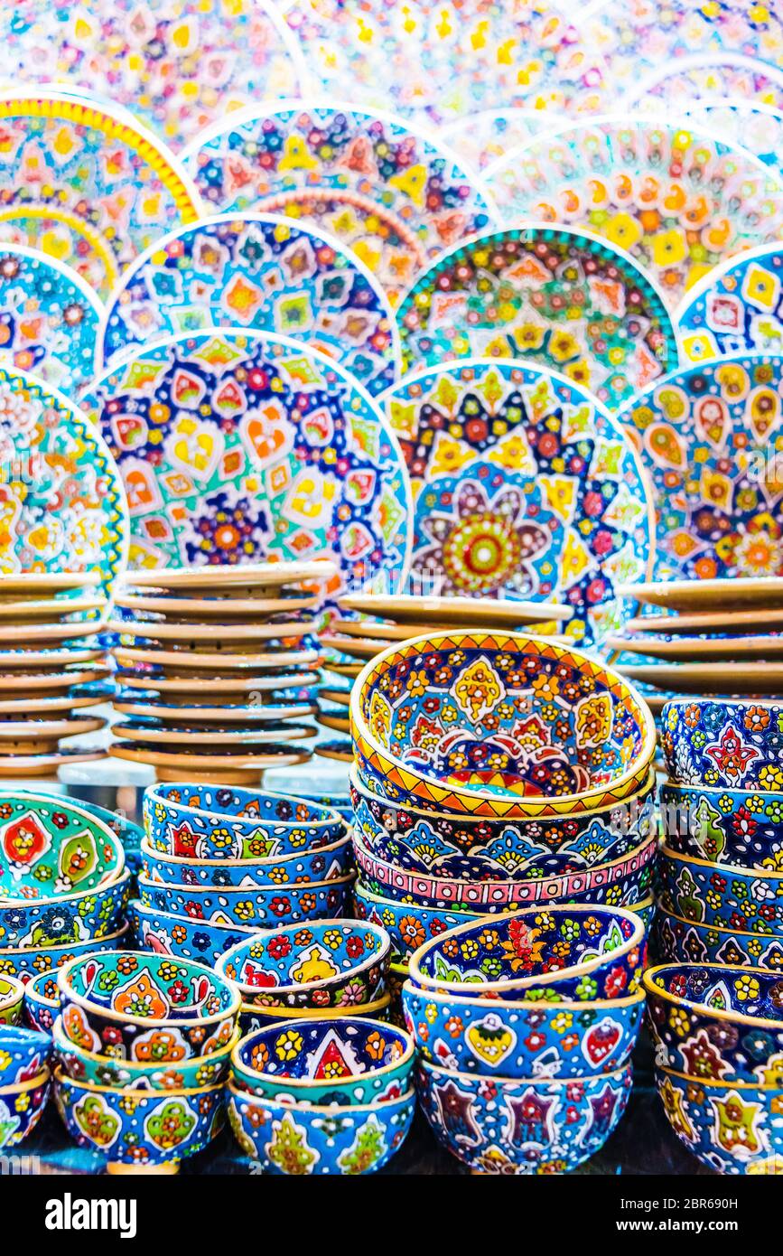 Colorful pottery dishes sold in Dubai souk, Unied Arab Emirates Stock ...