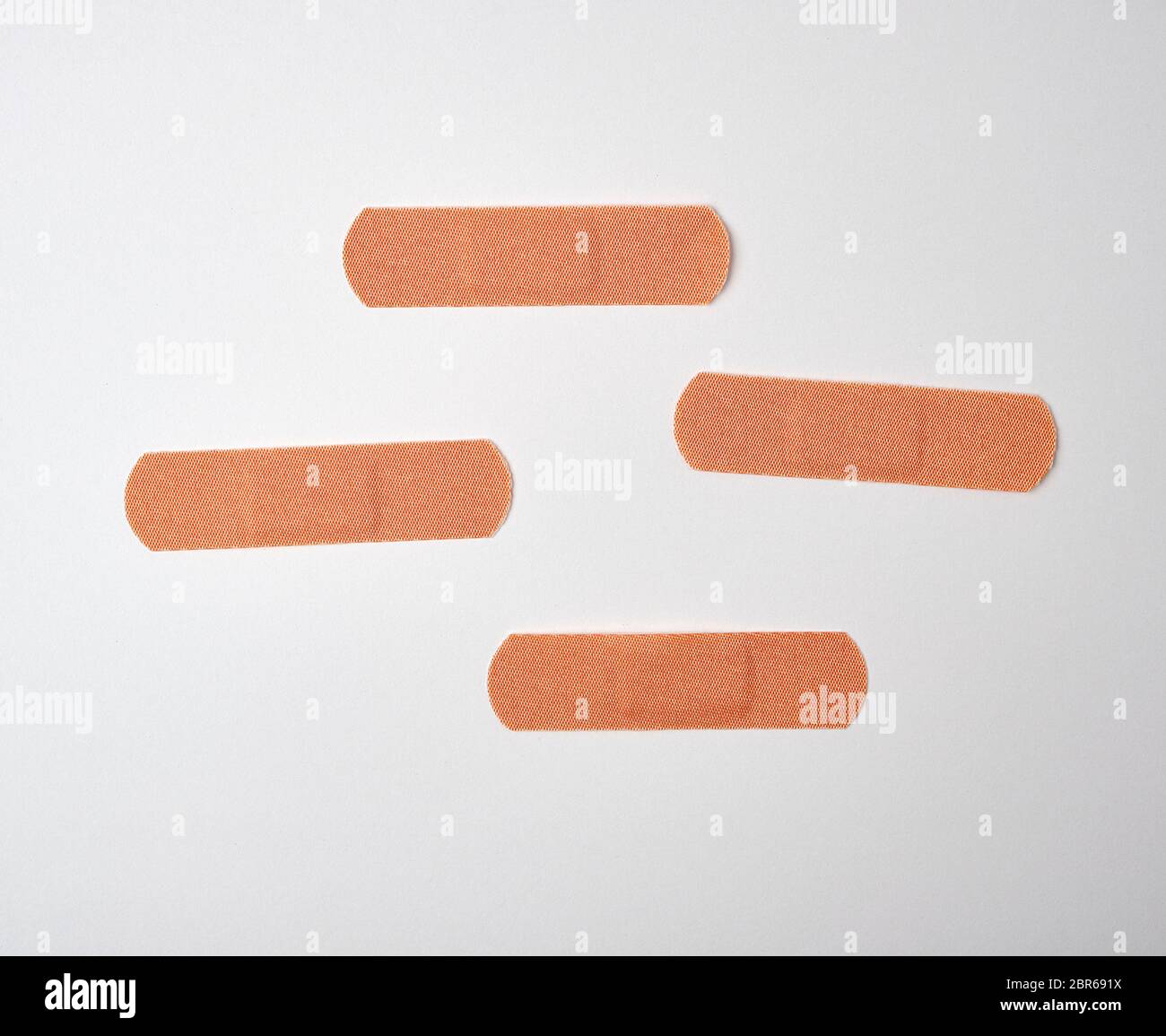 brown textile sticky patch for wounds on the skin of the body, white ...