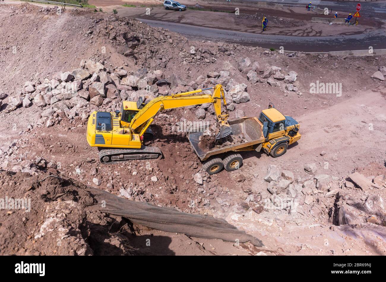 Industrial excavator machine loading construction truck vehicle heavy ...