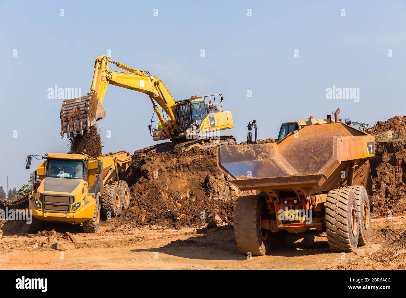 Construction industrial earthworks grader machine loading earth into ...