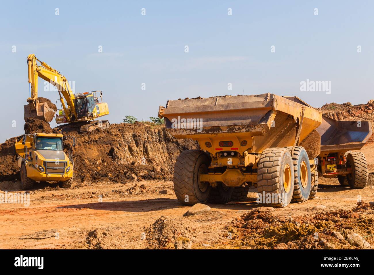 Construction industrial earthworks grader machine loading earth into ...