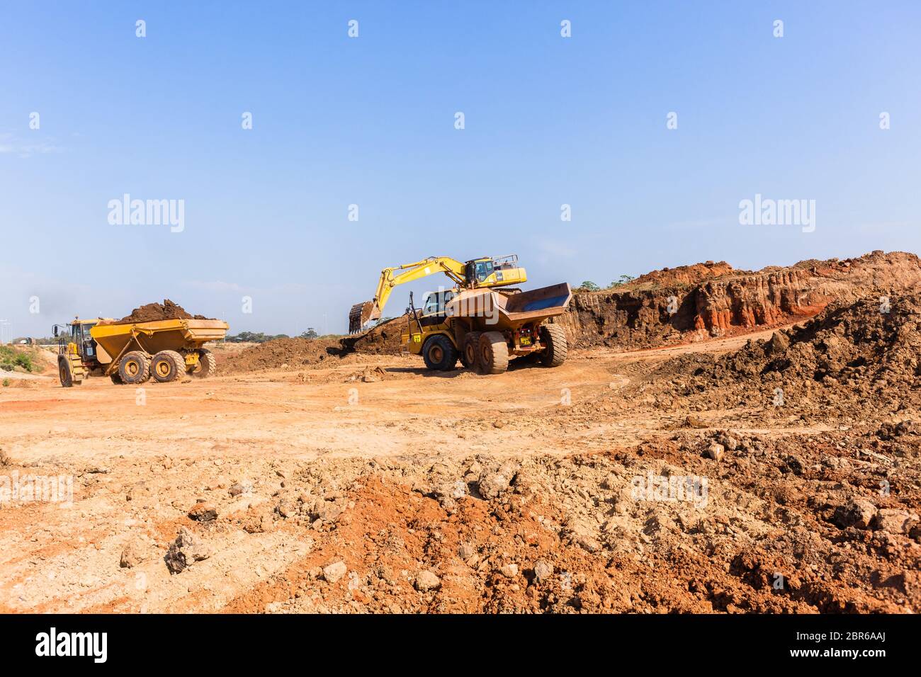 Construction industrial earthworks grader machine loading earth into ...