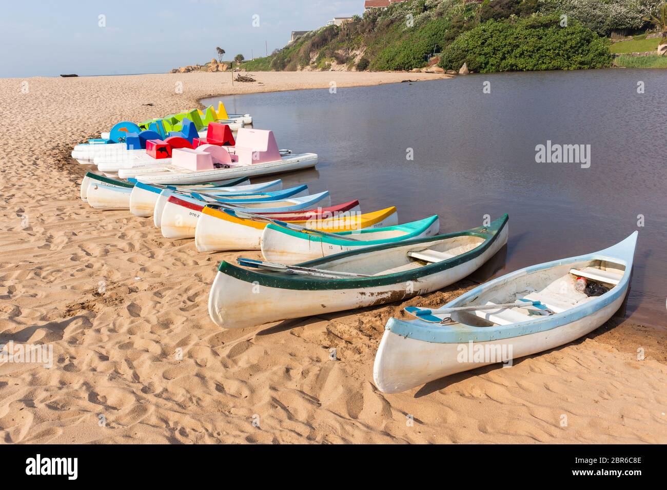 Scenic destination beach river lagoon paddle boats Stock Photo - Alamy