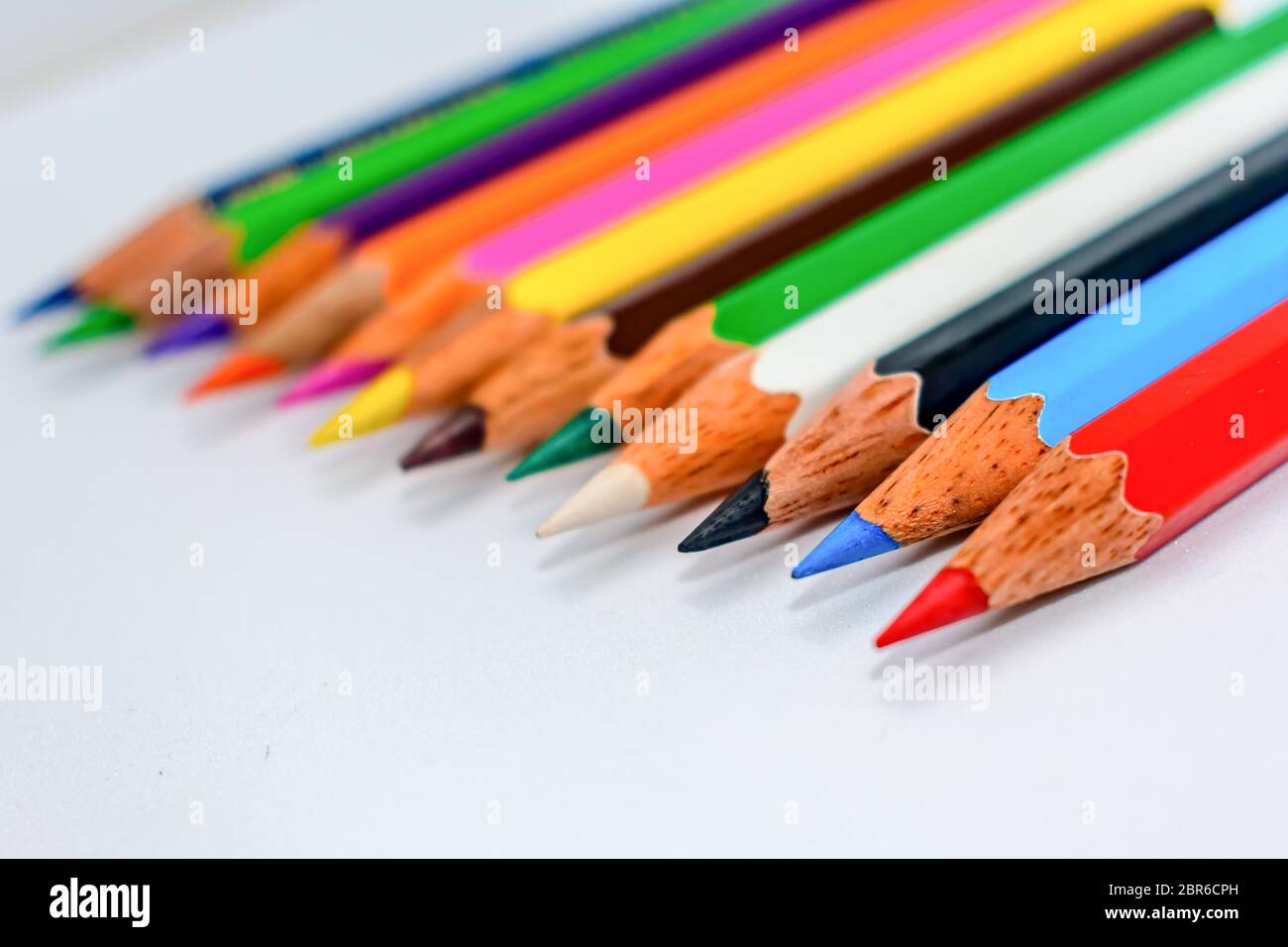 Close-up of a selection of Multi Colored pencils crayons, stick ...