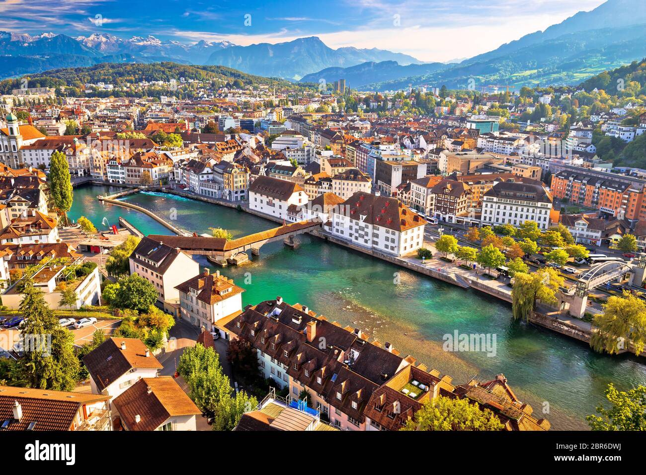 City of Luzern riverfront and rooftops aerial view, Alps landscape of ...