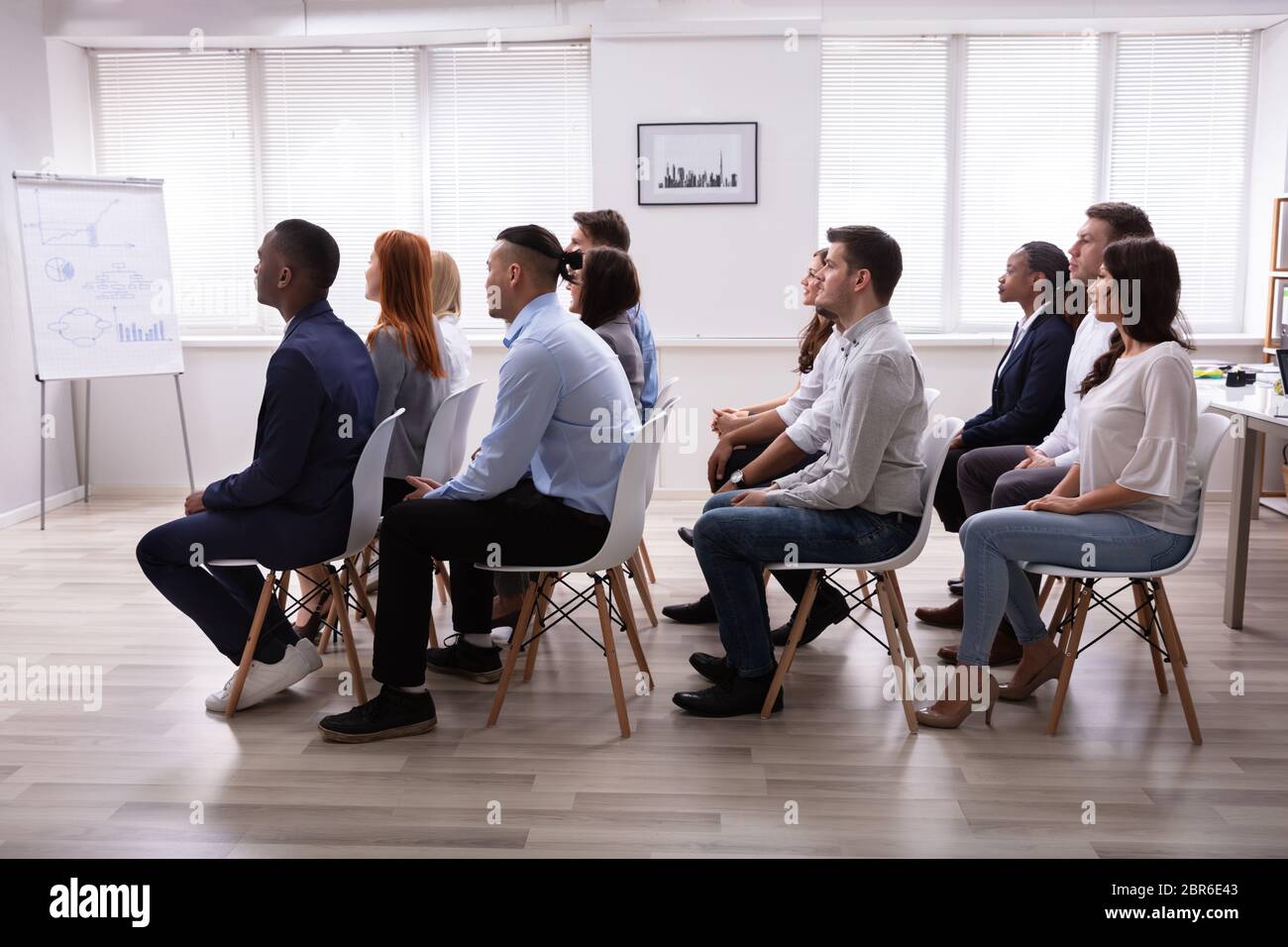 Diverse Group Of Successful Business People Sitting On Chair In The ...