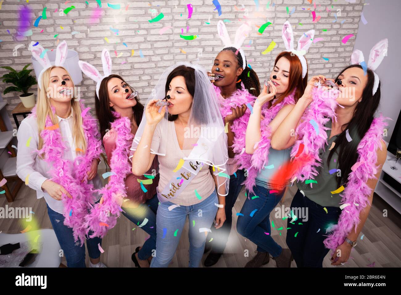 Beautiful Women Drinking Tequila Shots Wearing Feather Boa And Bunny ...