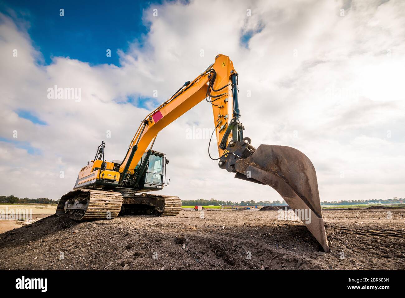 Big excavator in construction site Stock Photo - Alamy