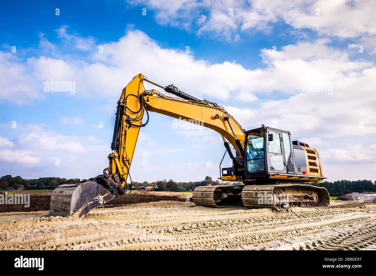 Big excavator in construction site Stock Photo - Alamy
