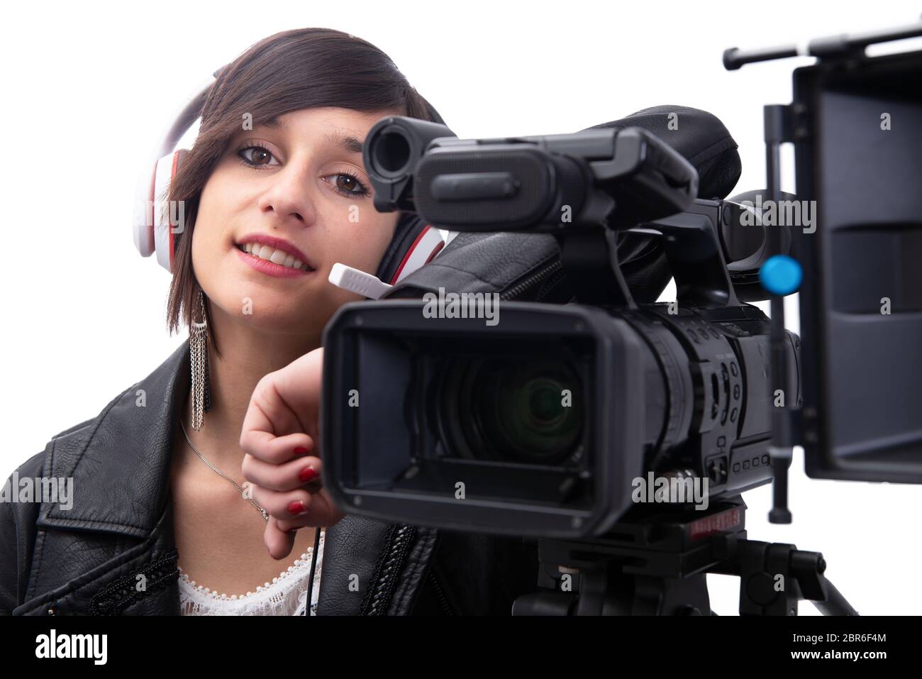 young woman with professional video camera, isolated on white ...
