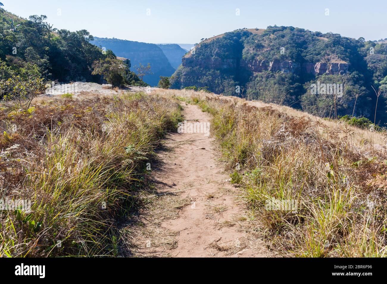 Hiking path overlooking rocky cliffs valley hills countryside hiking ...