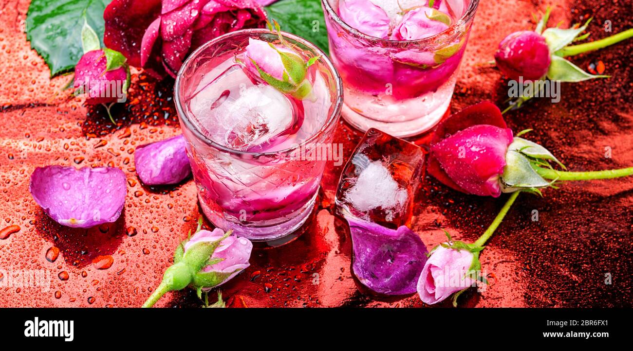 Alcoholic drink from tea rose.Flower cocktail.Summer party Stock Photo ...