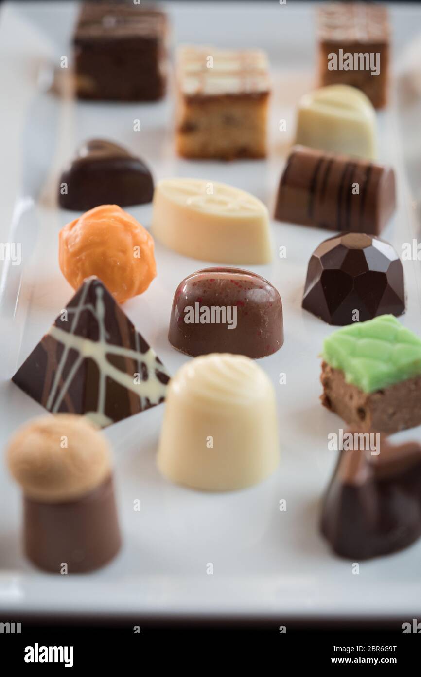 Mix of Chocolates on a table with black background, confectioners ...