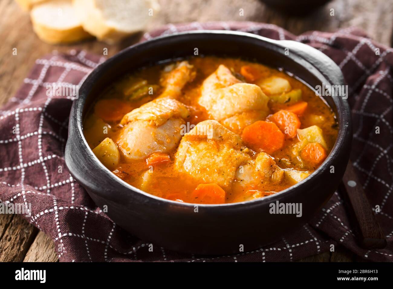 Fresh homemade chicken stew with potato, carrot and celery, seasoned ...