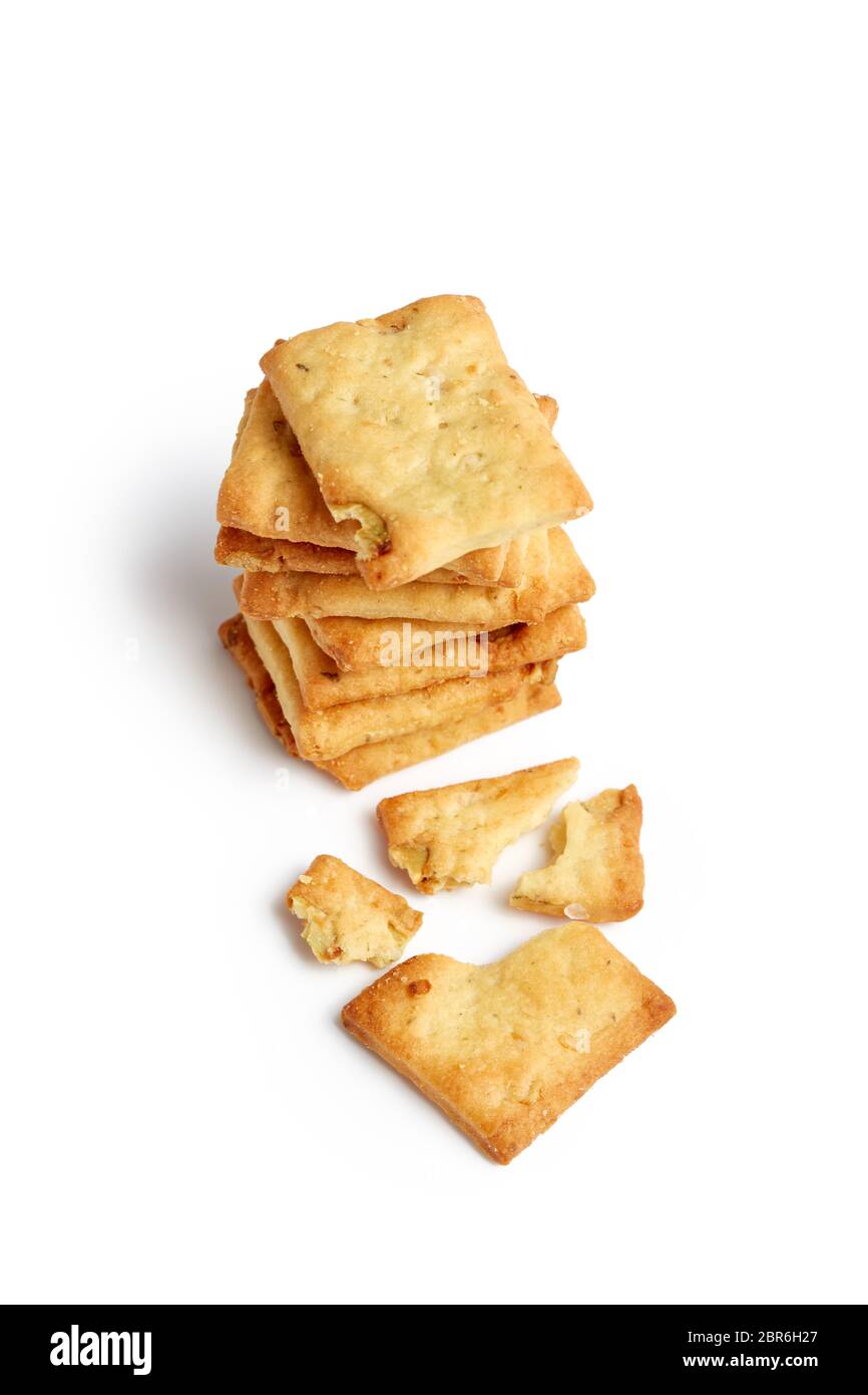 Tasty cookies: heap of whole salted crackers and one broken cookie ...