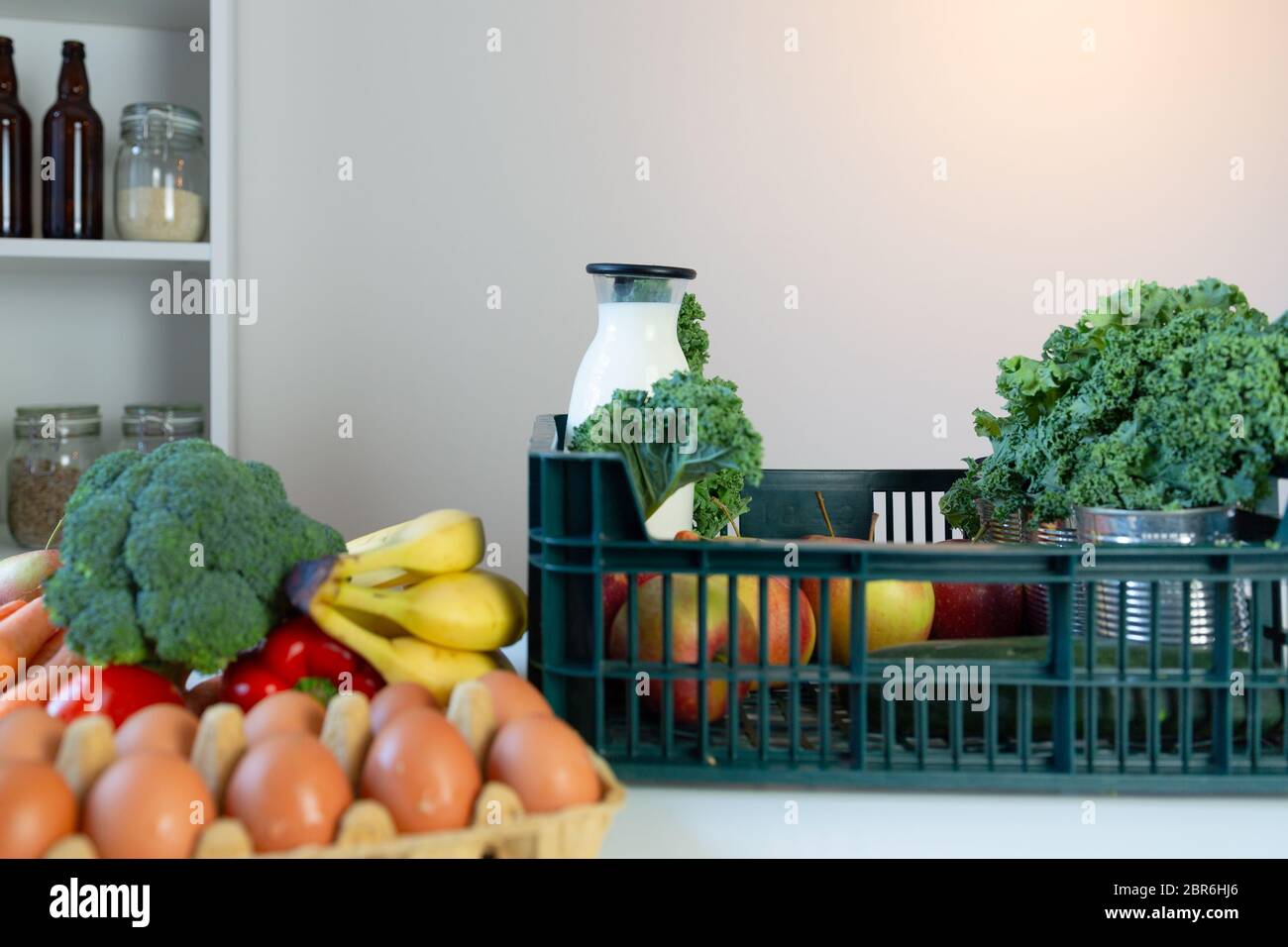 Fresh healthy groceries and vegetables from supermarket in green tray ...