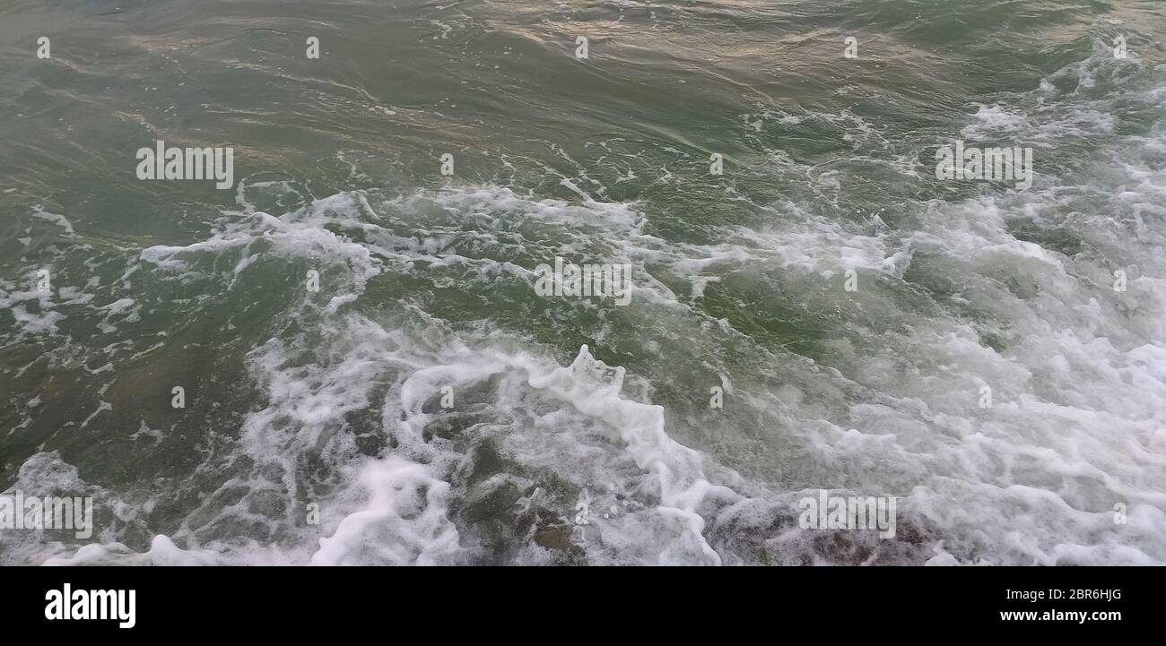 relaxing green sea waves background Stock Photo - Alamy