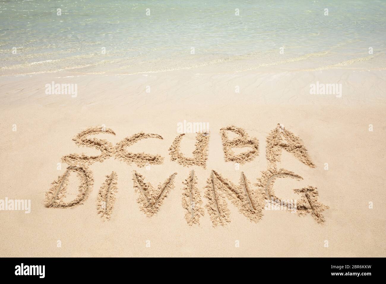 Alphabet writing on sand letter hi-res stock photography and images - Alamy