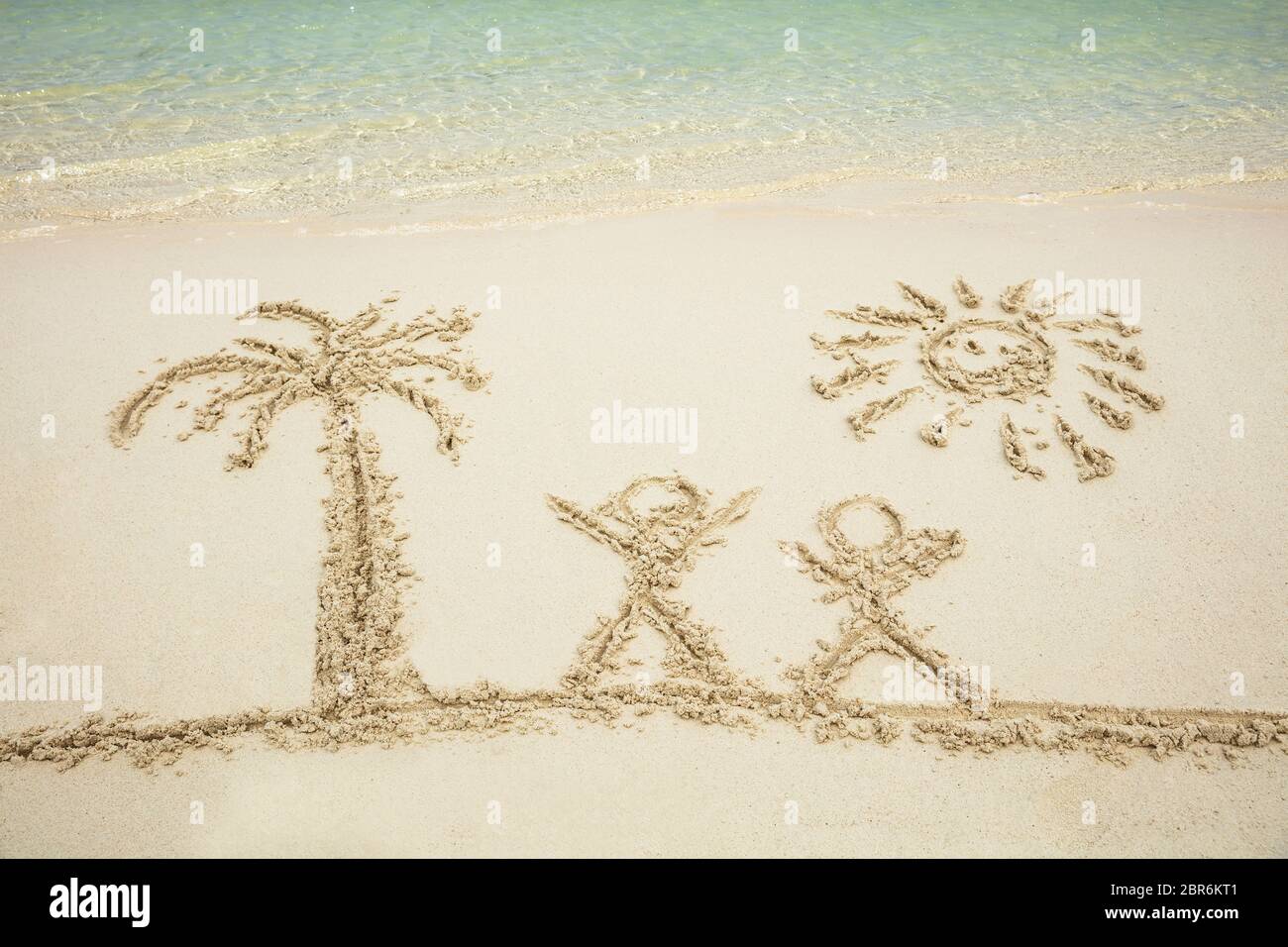Palm Tree And Figures On Sand At Beach Stock Photo - Alamy