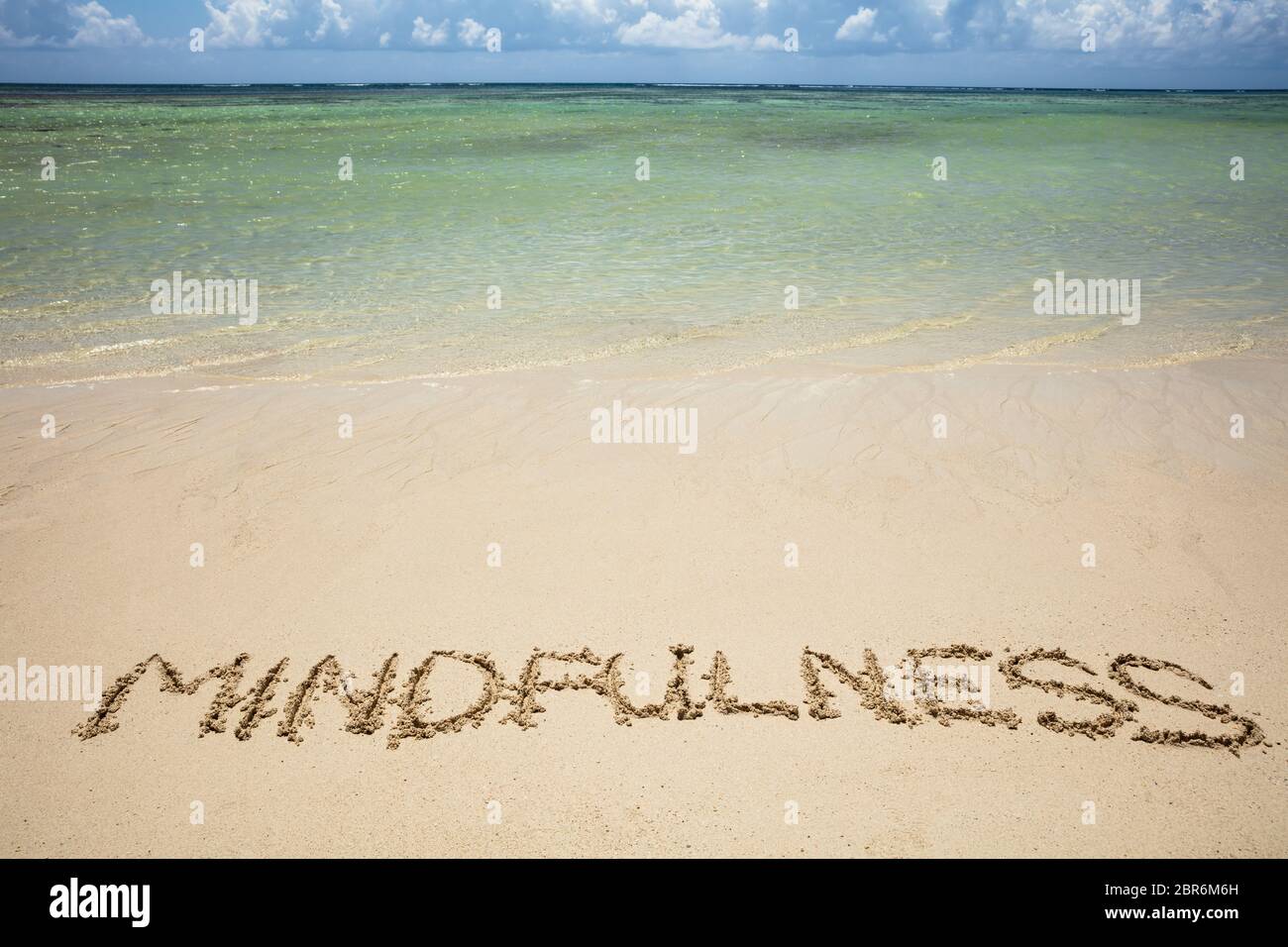 An Overhead View Of Mindfulness Written Text On Sand Near The Sea At ...