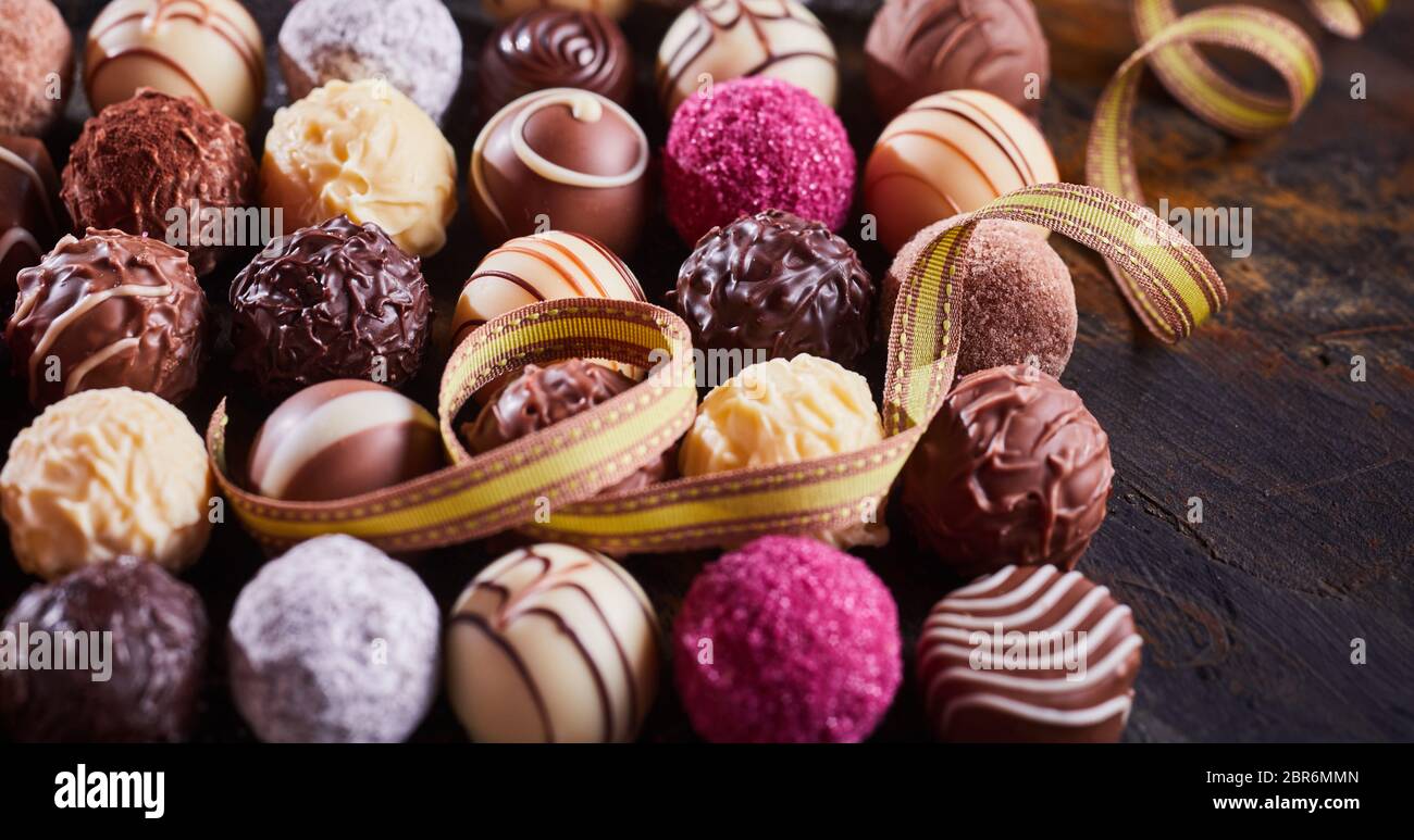 Assortment of gourmet handmade speciality chocolate pralines with ...