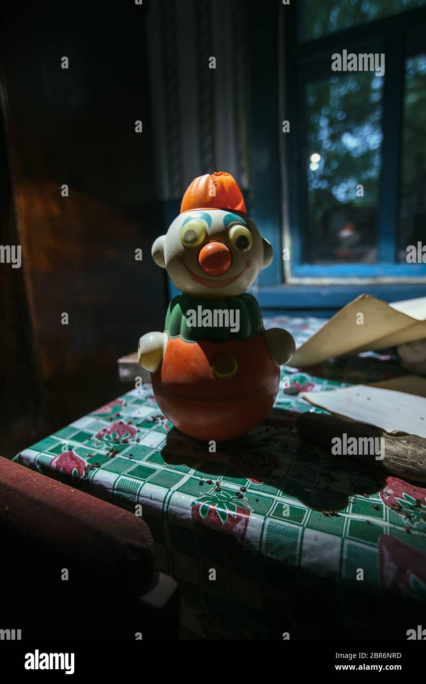 Old creepy roly-poly toy in abandoned house Stock Photo - Alamy