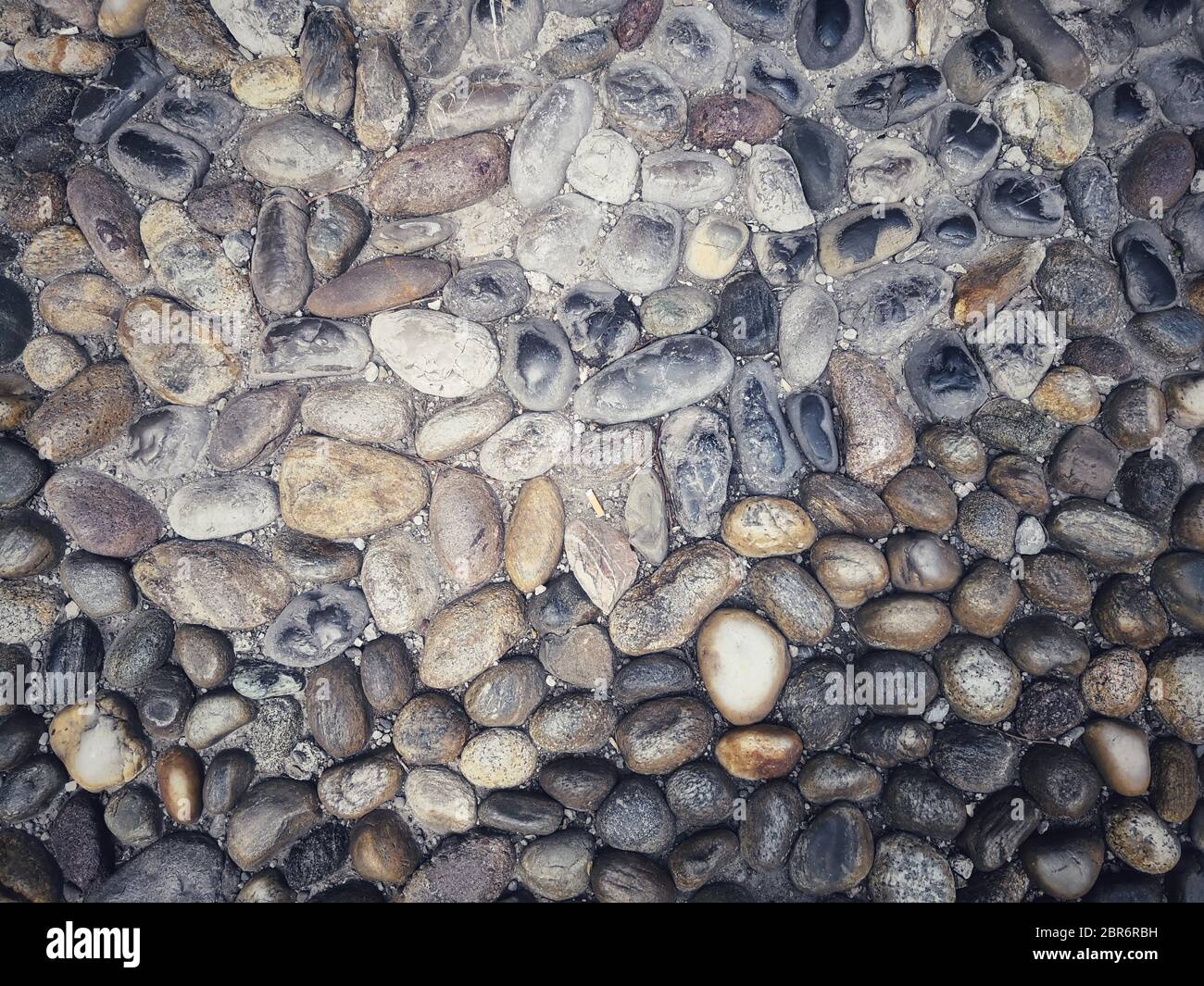 Color image of a pavement made of round stones Stock Photo - Alamy
