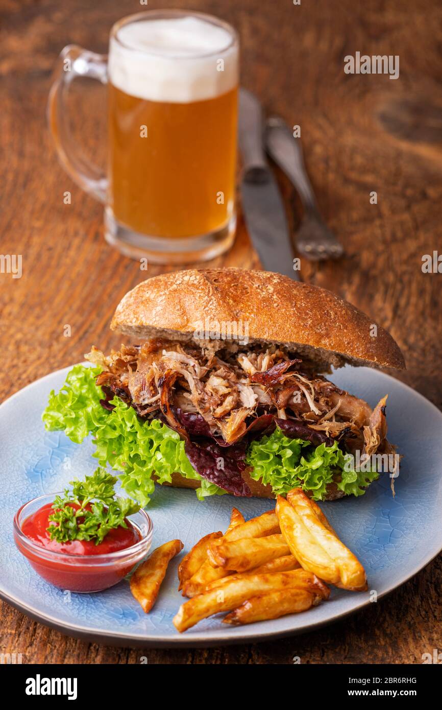 pulled pork in a bun with beer Stock Photo - Alamy