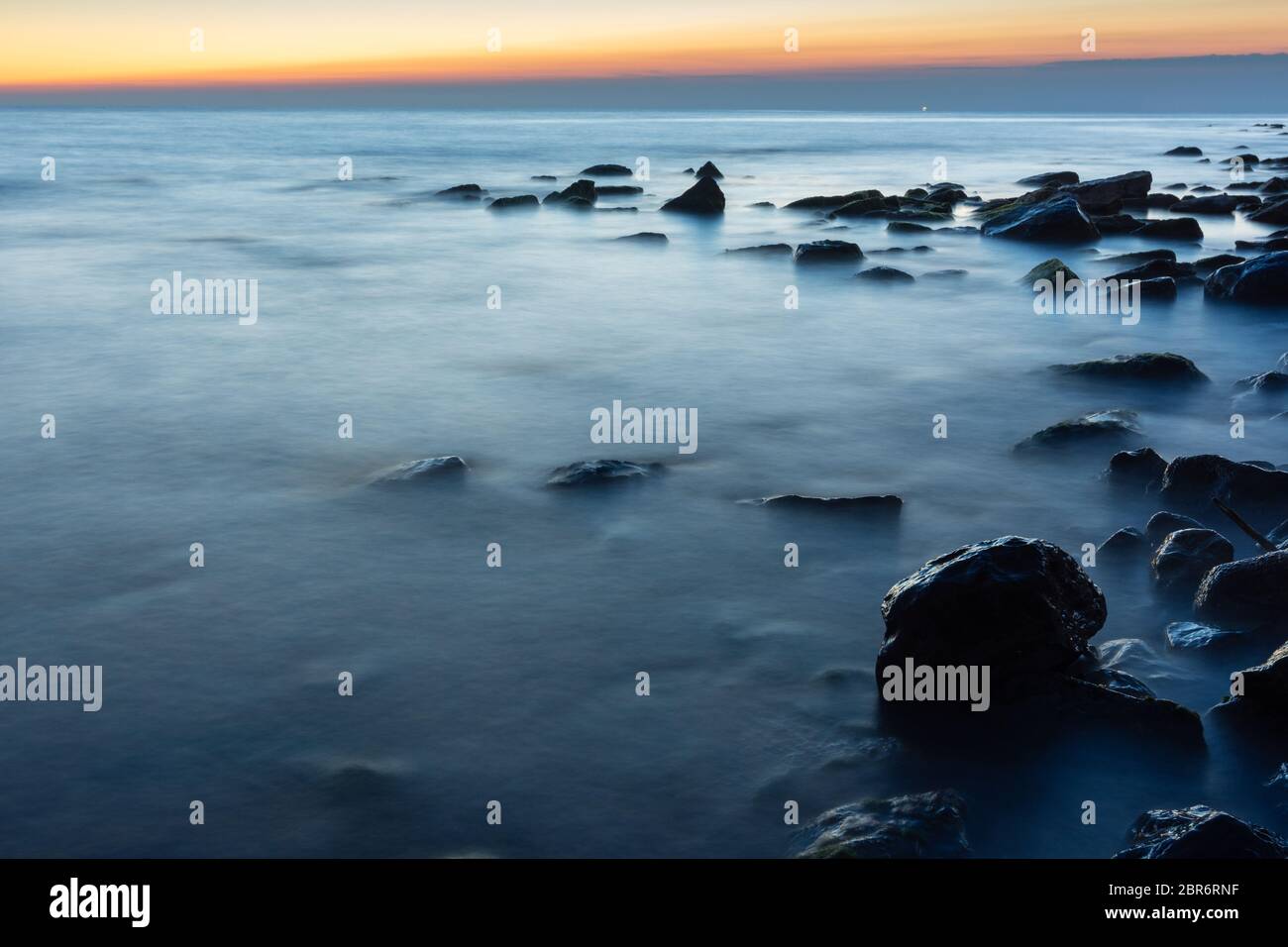 Rocky sea beach after sunset, Black Sea, Anapa, Russia Stock Photo - Alamy