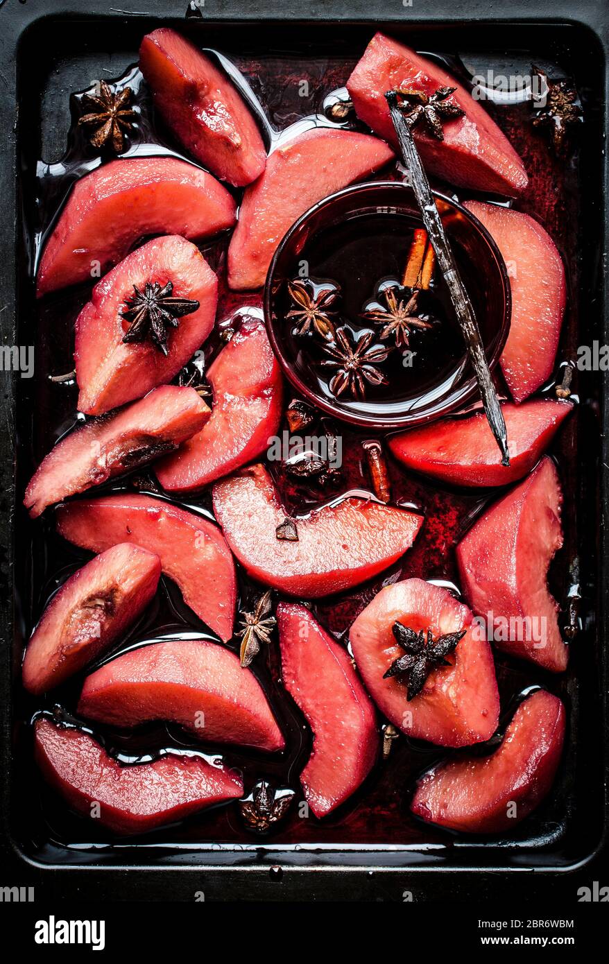 Red wine poached quinces Stock Photo - Alamy