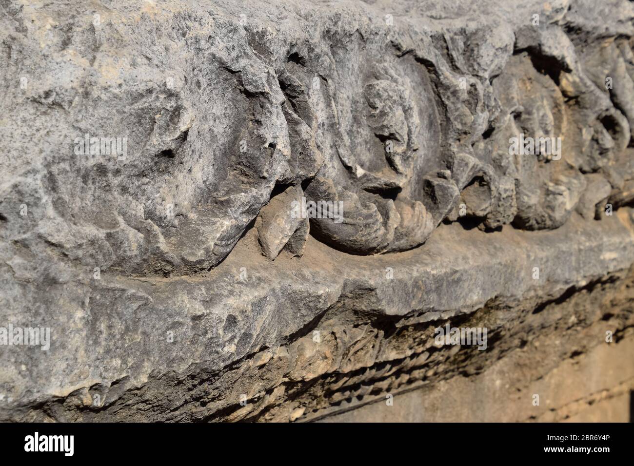 The element of the gate of Hadrian on the ground near the gate. Ruins ...
