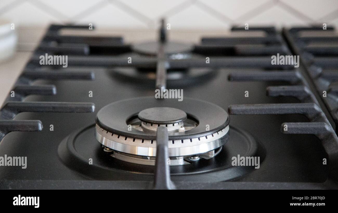 Gas burner on black modern kitchen stove. kitchen gas cooker with ...