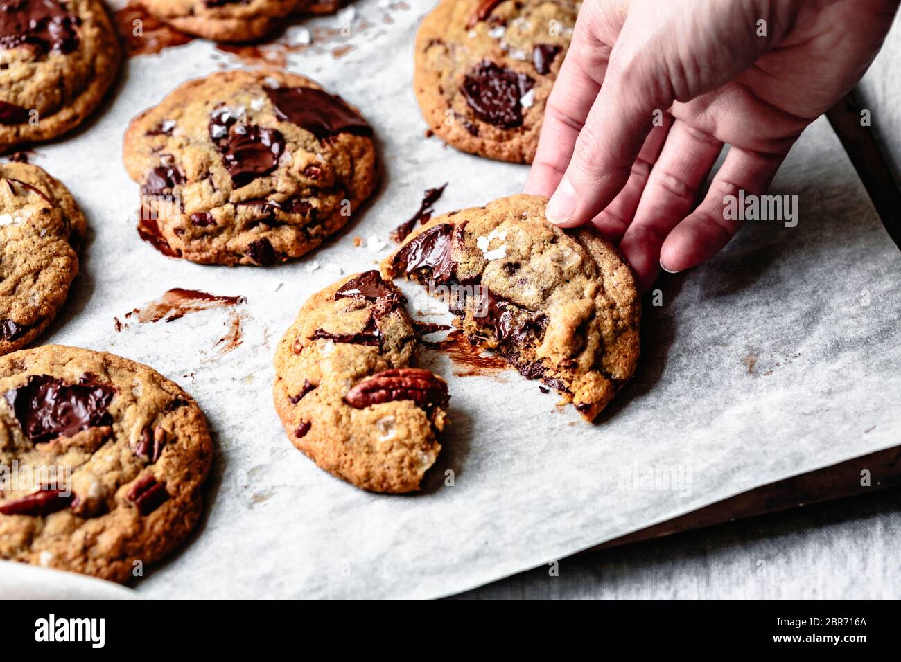 Closeup hand breaking sweet cookies hi-res stock photography and images ...