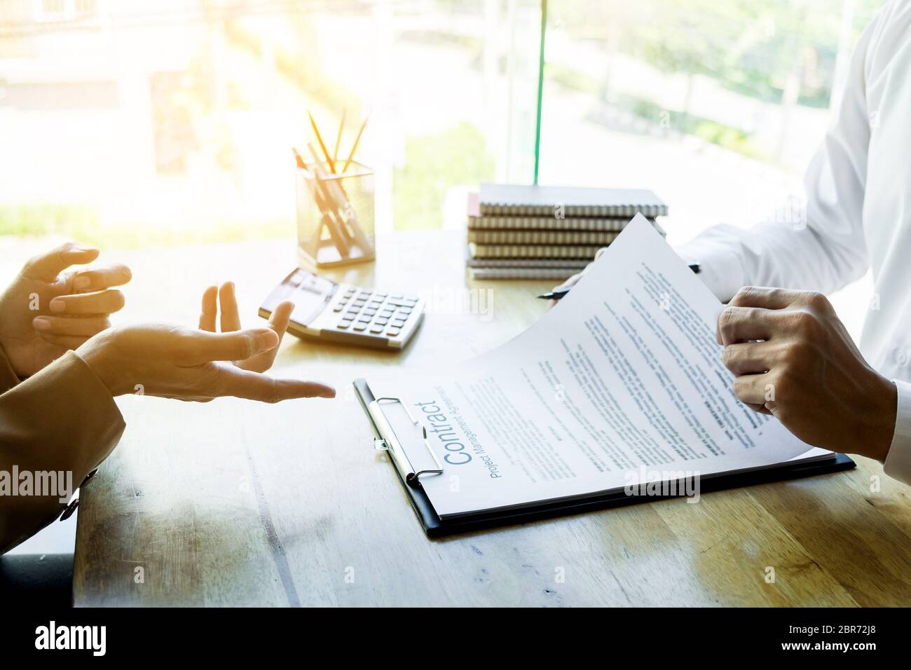 Young business team working with new startup project offering contract ...