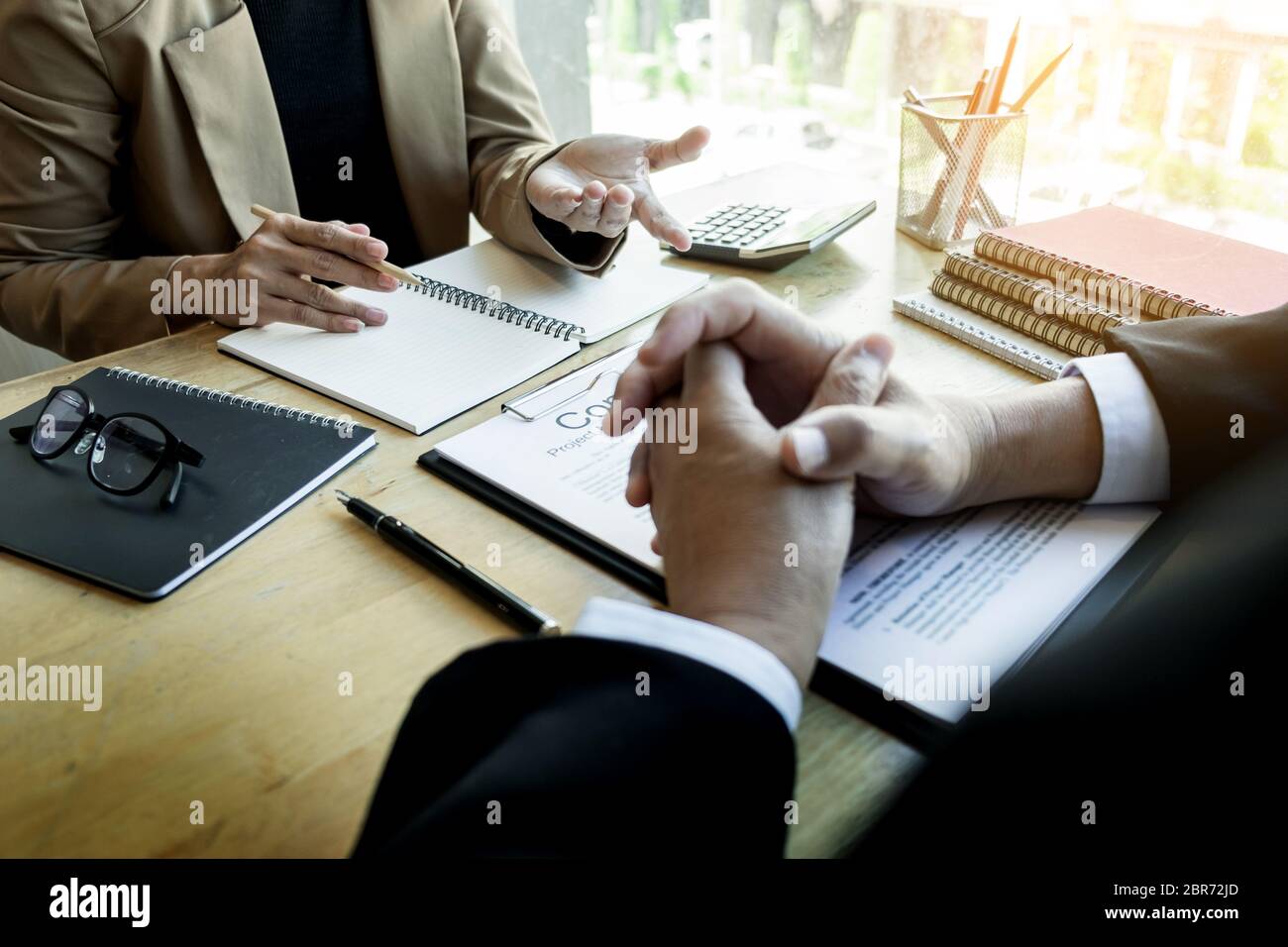 Young business team working with new startup project offering contract ...