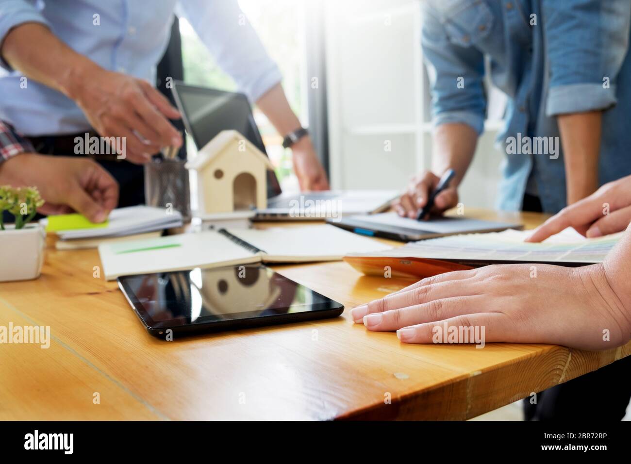 Architects Sitting Around Table Having Diverse Brainstorm Meeting ...
