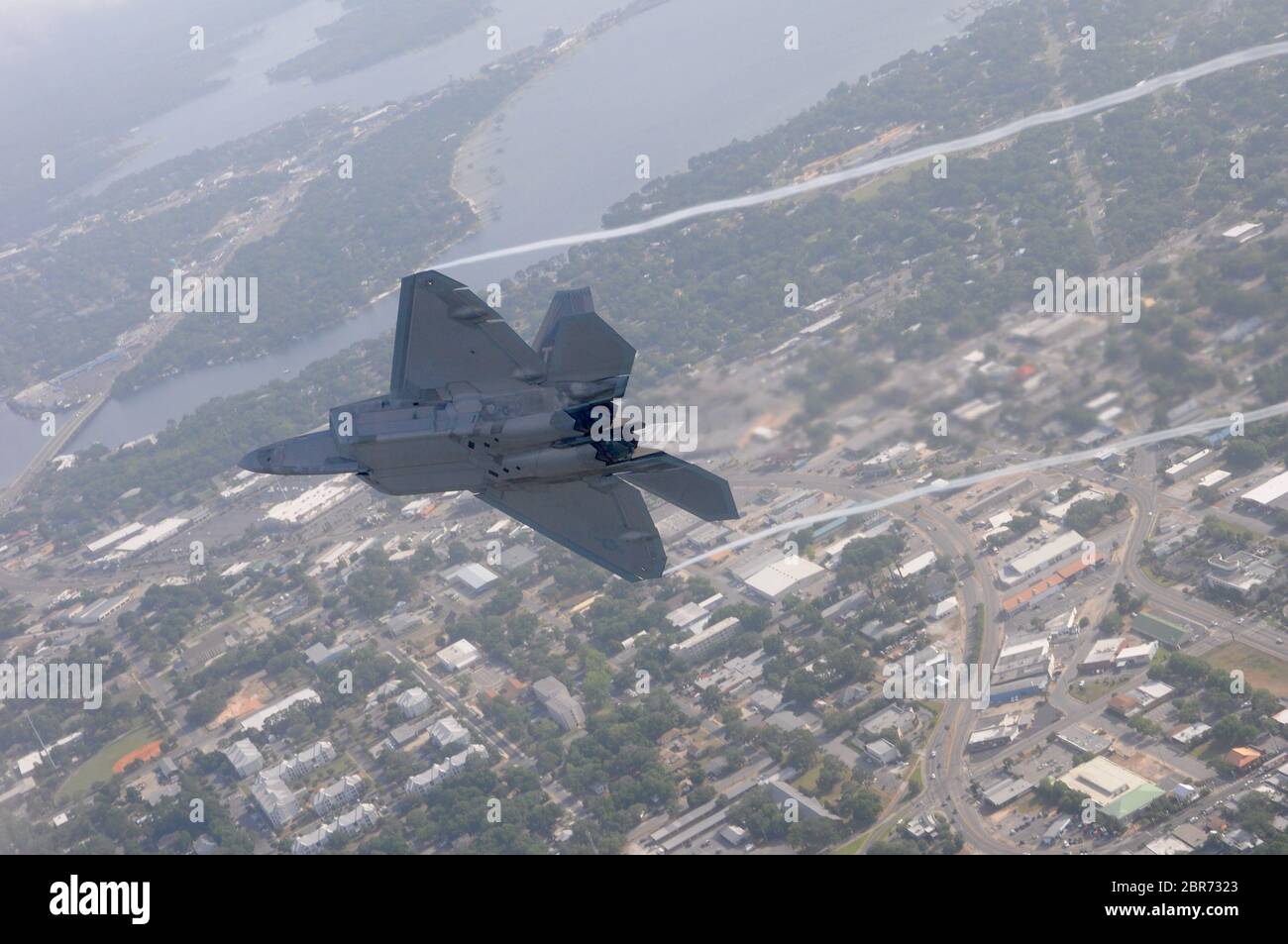A F-22 Raptor from the 325th Fighter Wing over the Emerald Coast. The ...