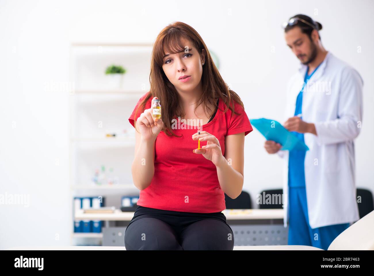Female diabetic patient visiting young doctor Stock Photo - Alamy