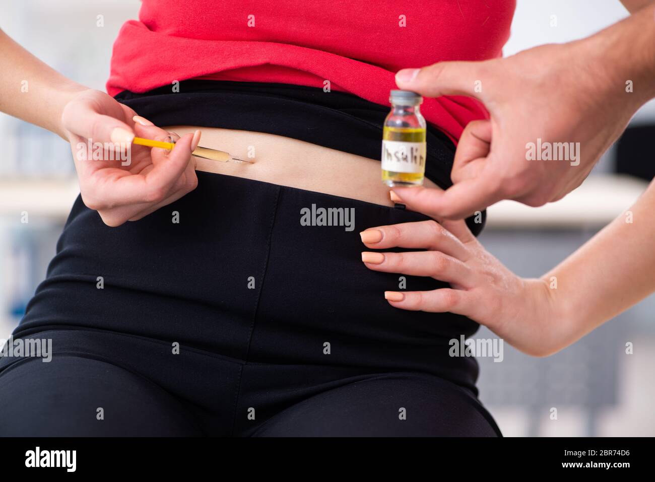 Female diabetic patient visiting young doctor Stock Photo - Alamy