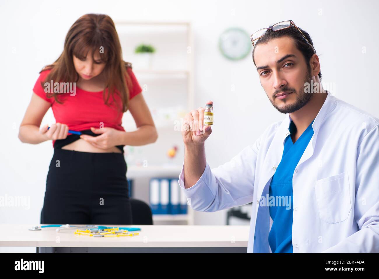 Female diabetic patient visiting young doctor Stock Photo - Alamy