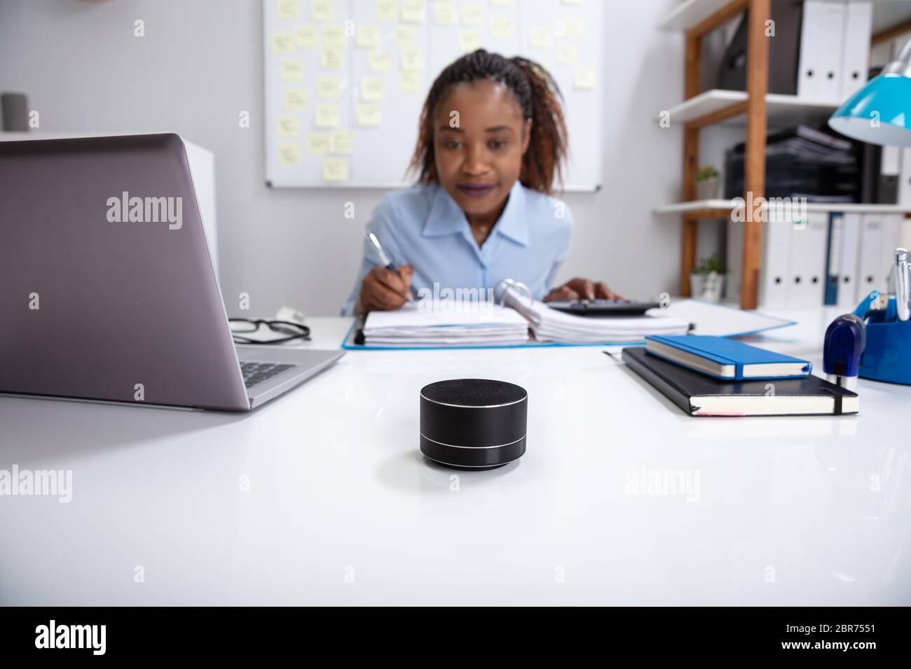 Close-up Of Voice Assistant In Front Of Businesswoman Stock Photo - Alamy