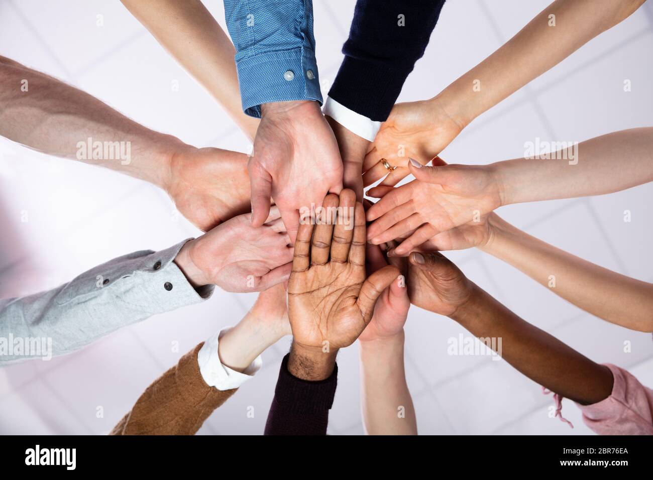 Multi-ethnic Group Of People Stacking Hand Showing Unity Stock Photo ...