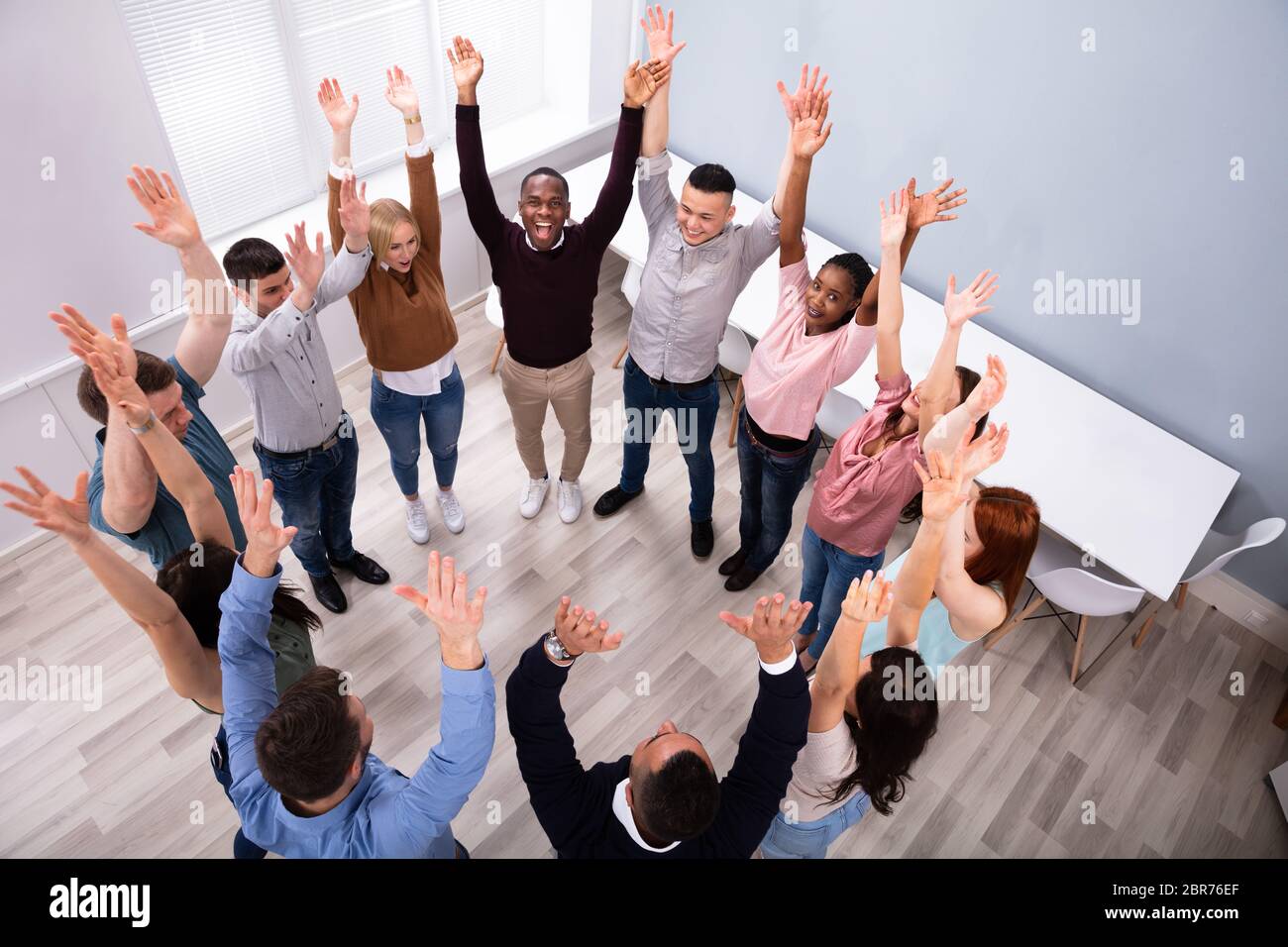 Hands together circle multiracial hi-res stock photography and images ...