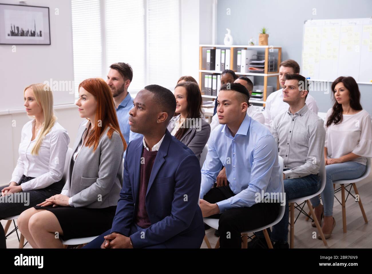Diverse Group Of Successful Business People Sitting On Chair In The ...