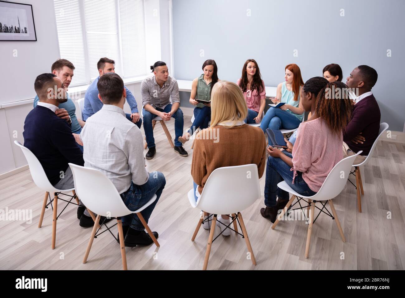 Multiracial advice talking hi-res stock photography and images - Alamy