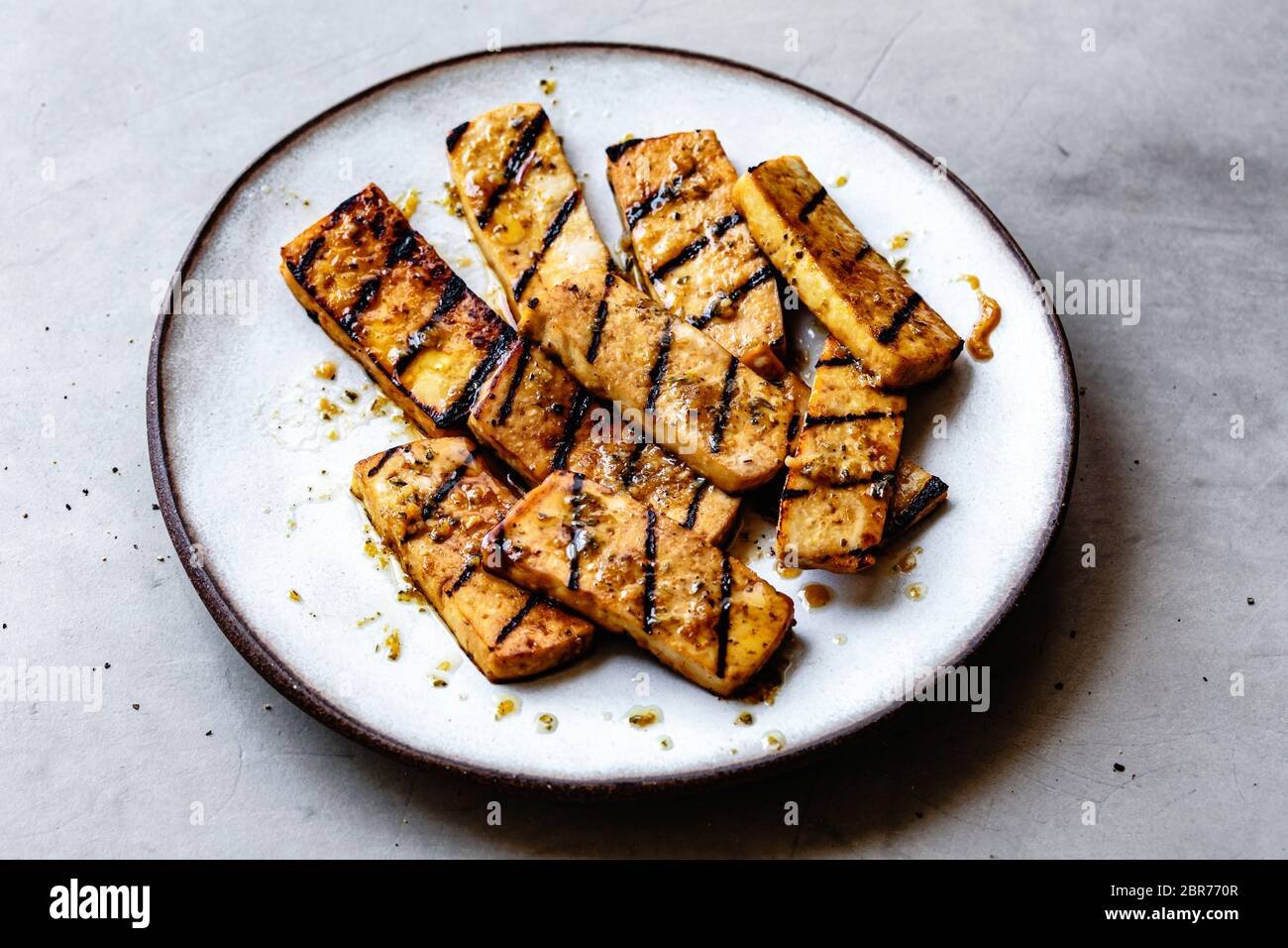 Pieces of grilled marinated tofu Stock Photo - Alamy